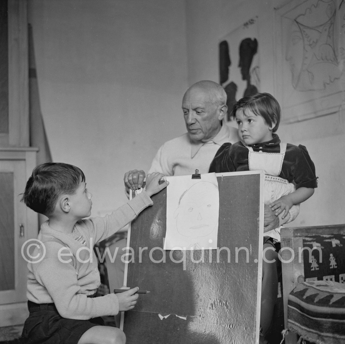 Encouraged by his father, Claude Picasso tries to do a portrait of ...