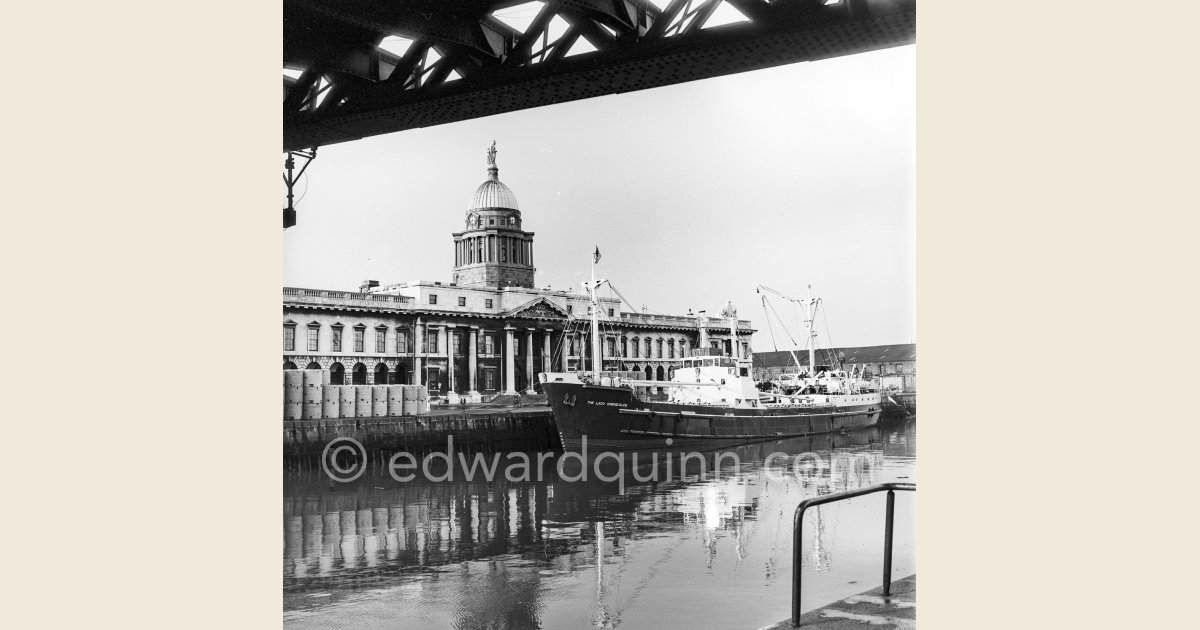 The River Liffey with Custom House, the Loop Line railroad Bridge above ...
