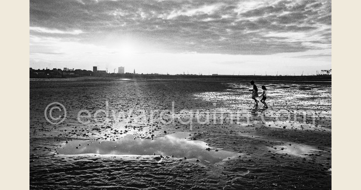 Children playing on the Sandymount Strand. Dublin 1963. Published in ...