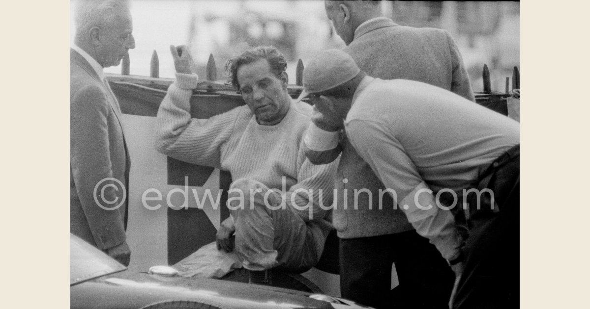 Innes Ireland pushes his N° 22 Lotus 18 uphill and right around the ...