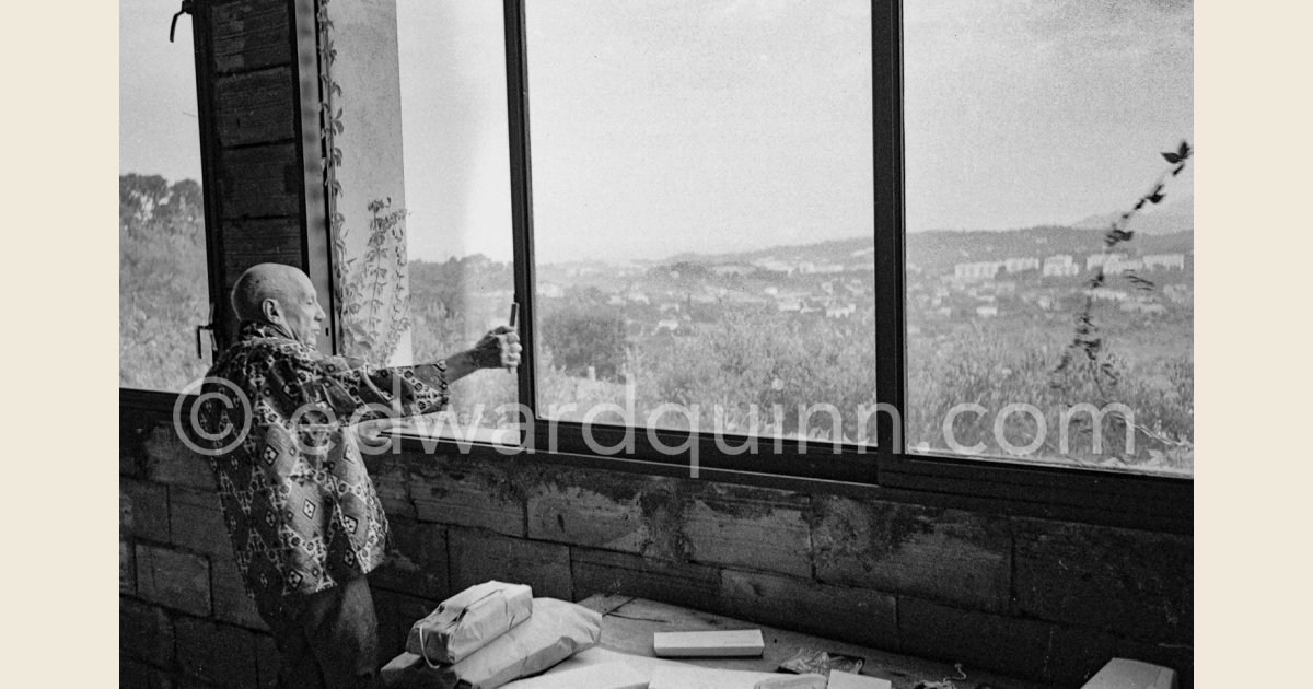 Pablo Picasso on a window of one of the studios he added to Mas Notre ...